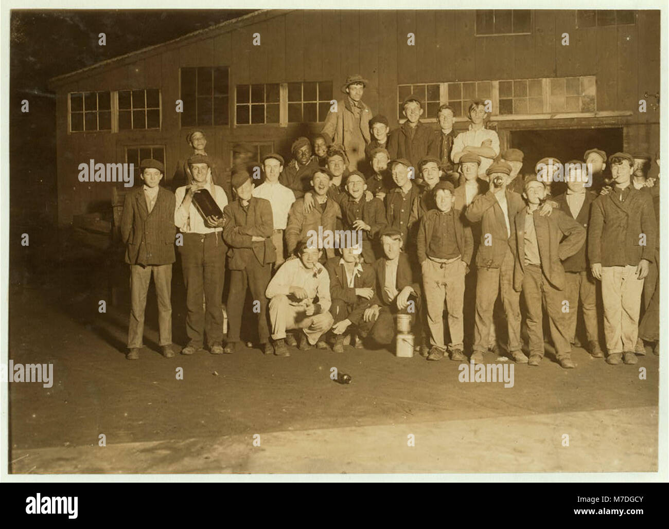 Workers in Cumberland Glass Works, Bridgeton, New Jersey, take a break ...