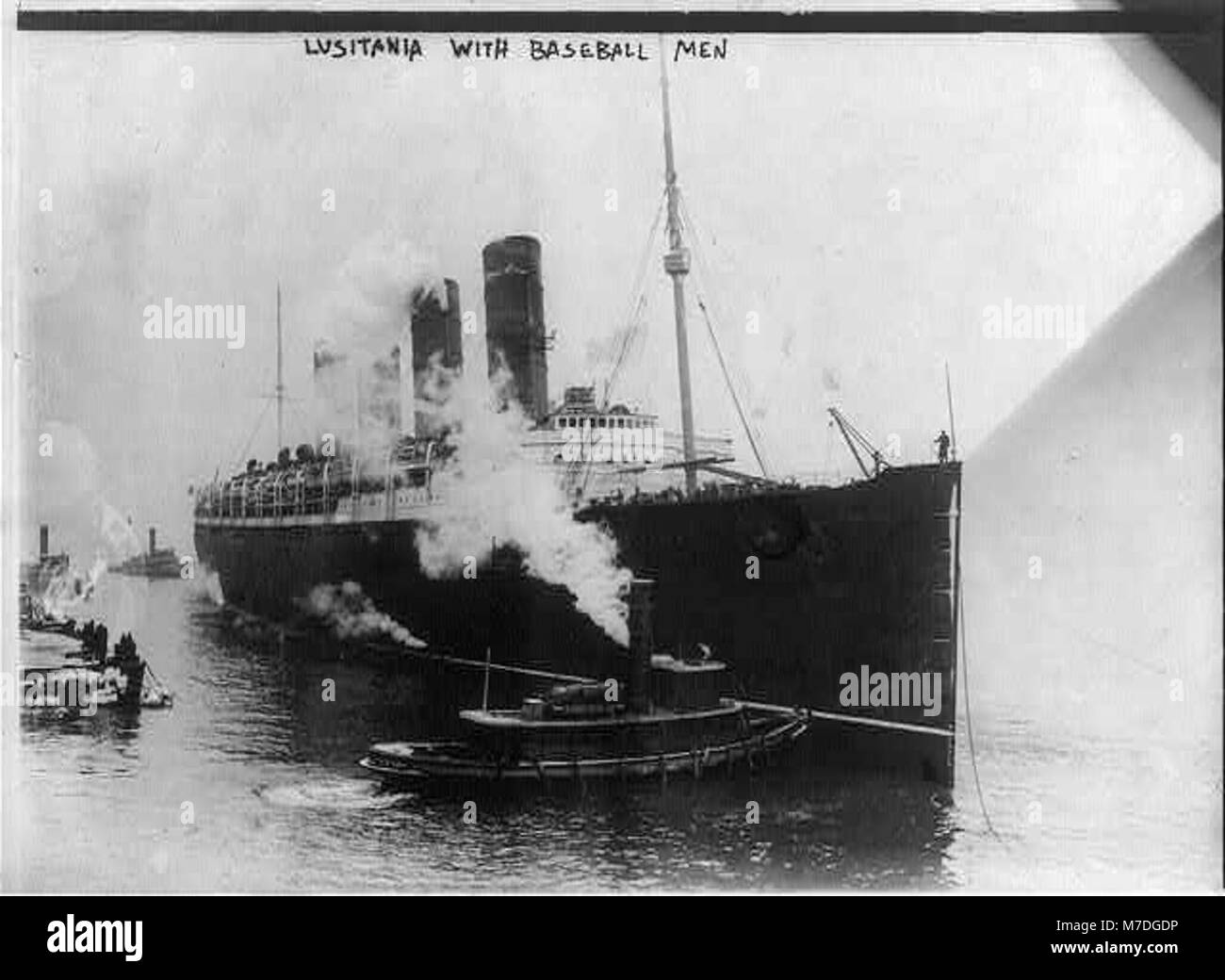 The Lusitania, a famous ocean liner, being guided into a pier in New ...