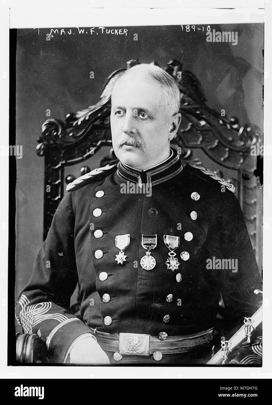 This photograph shows Major W.F. Tucker seated in military uniform. It ...