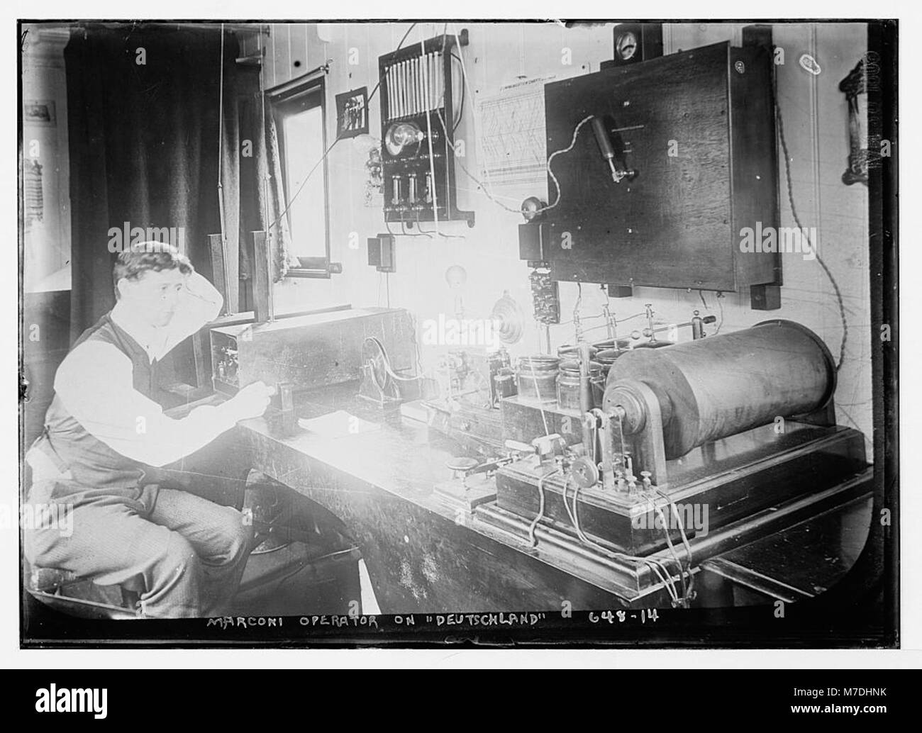 A photograph of a Marconi operator aboard the ship *Deutschland*, shown ...