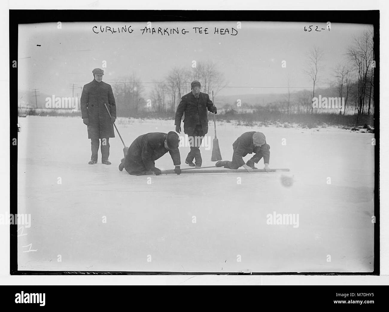 This image shows the marking of a tee head on a curling field, a ...