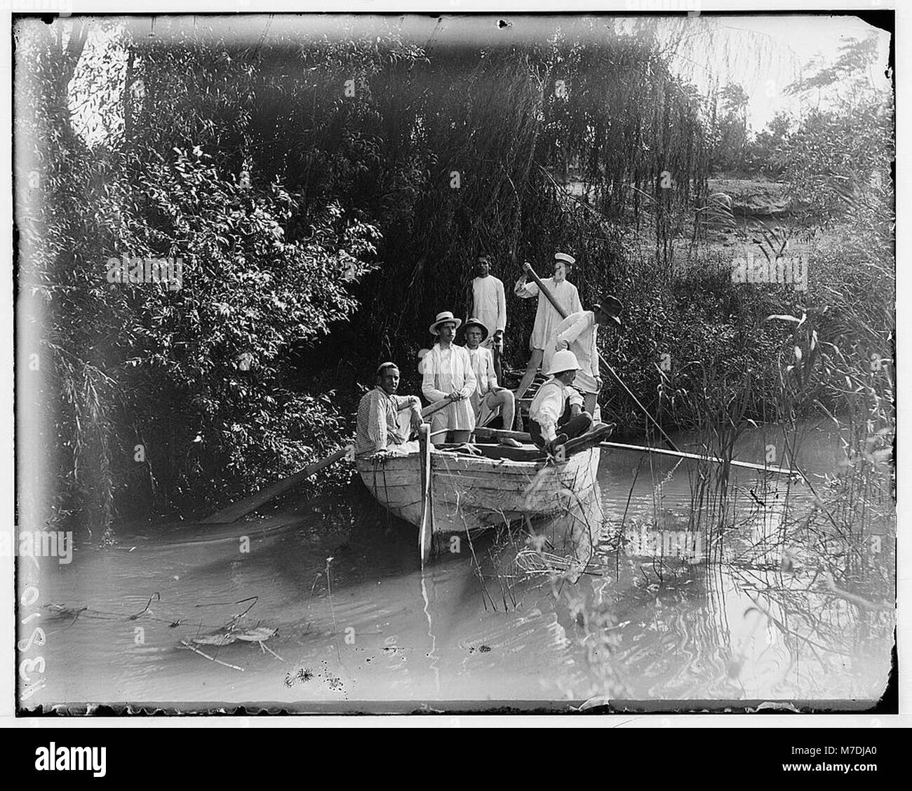 A photograph of the Matson family on the Auja River, capturing a moment ...
