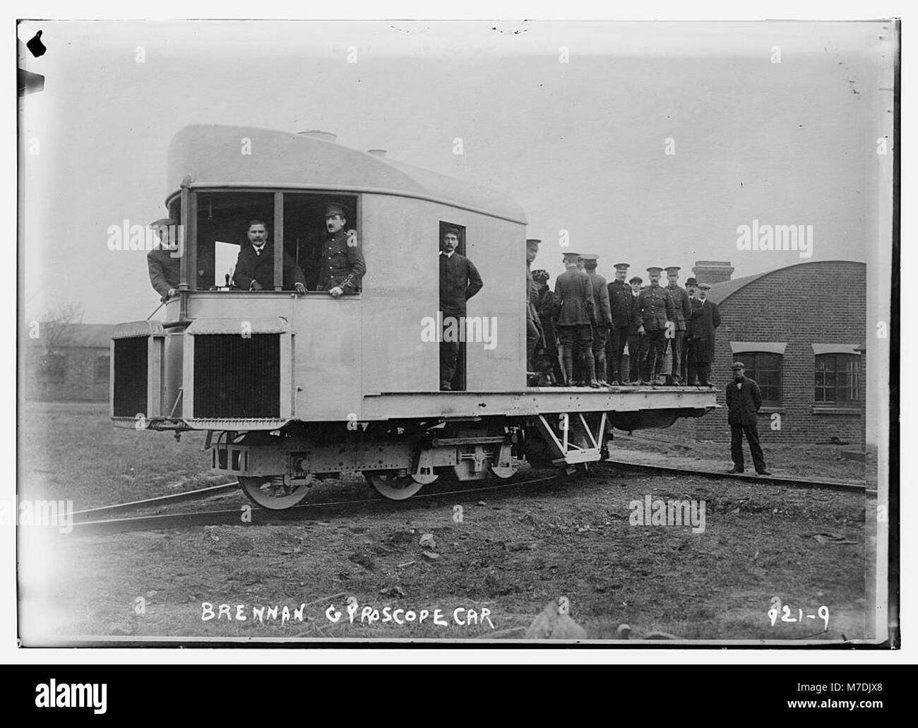 Men and officers are pictured operating the Brennan gyroscope car, an ...