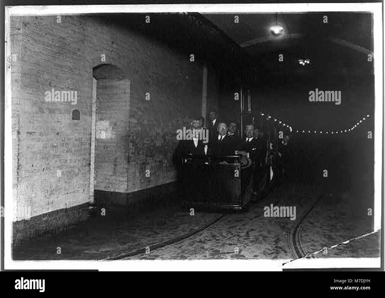 Photograph of men aboard a subway car of the U.S. Capitol, capturing ...