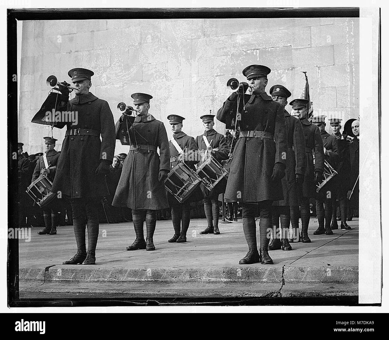 A military band is depicted performing at a ceremony, with the ...