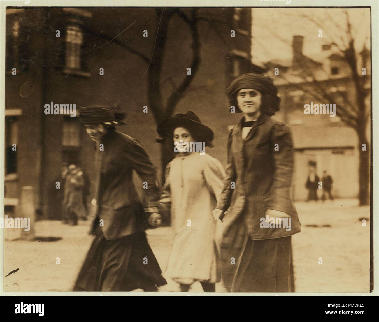 A historical photograph depicting mill girls and Pacific girls ...