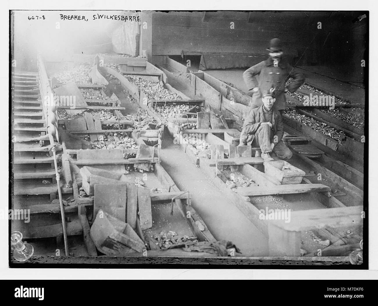 This photograph shows miners working with coal boxes in Wilkes-Barre ...