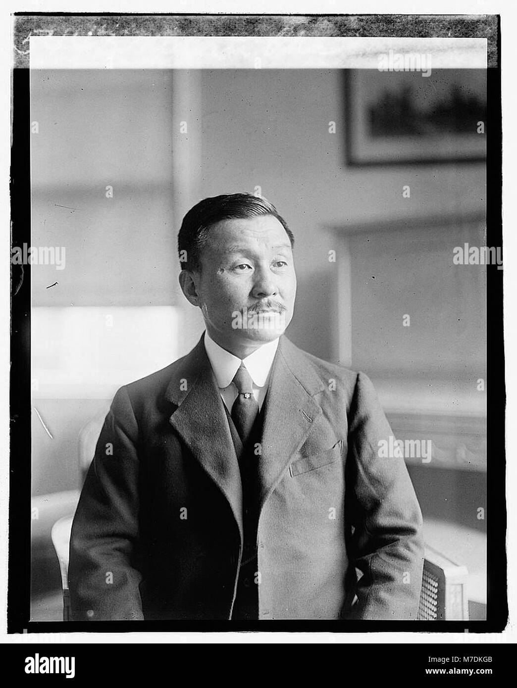 This photograph features Minoru Oka, a significant figure, known for ...