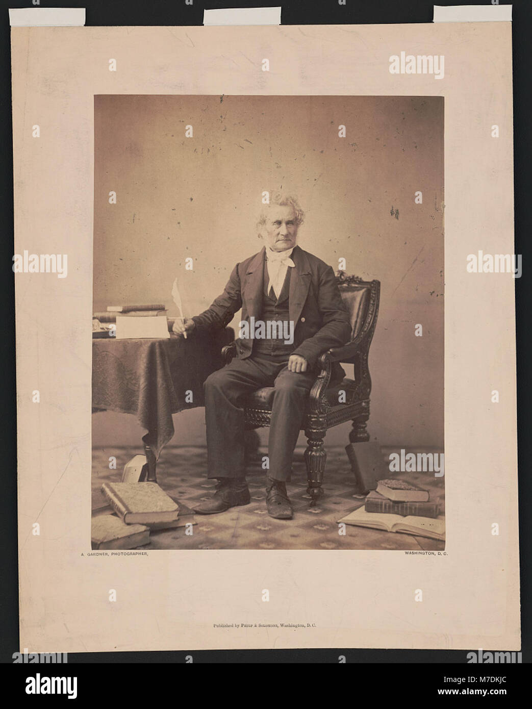 A full-length portrait of Peter Force, an American historian, seated at ...