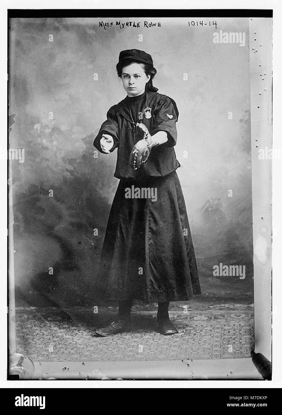 Miss Myrtle Rowe is pictured holding a baseball mitt, likely indicating ...