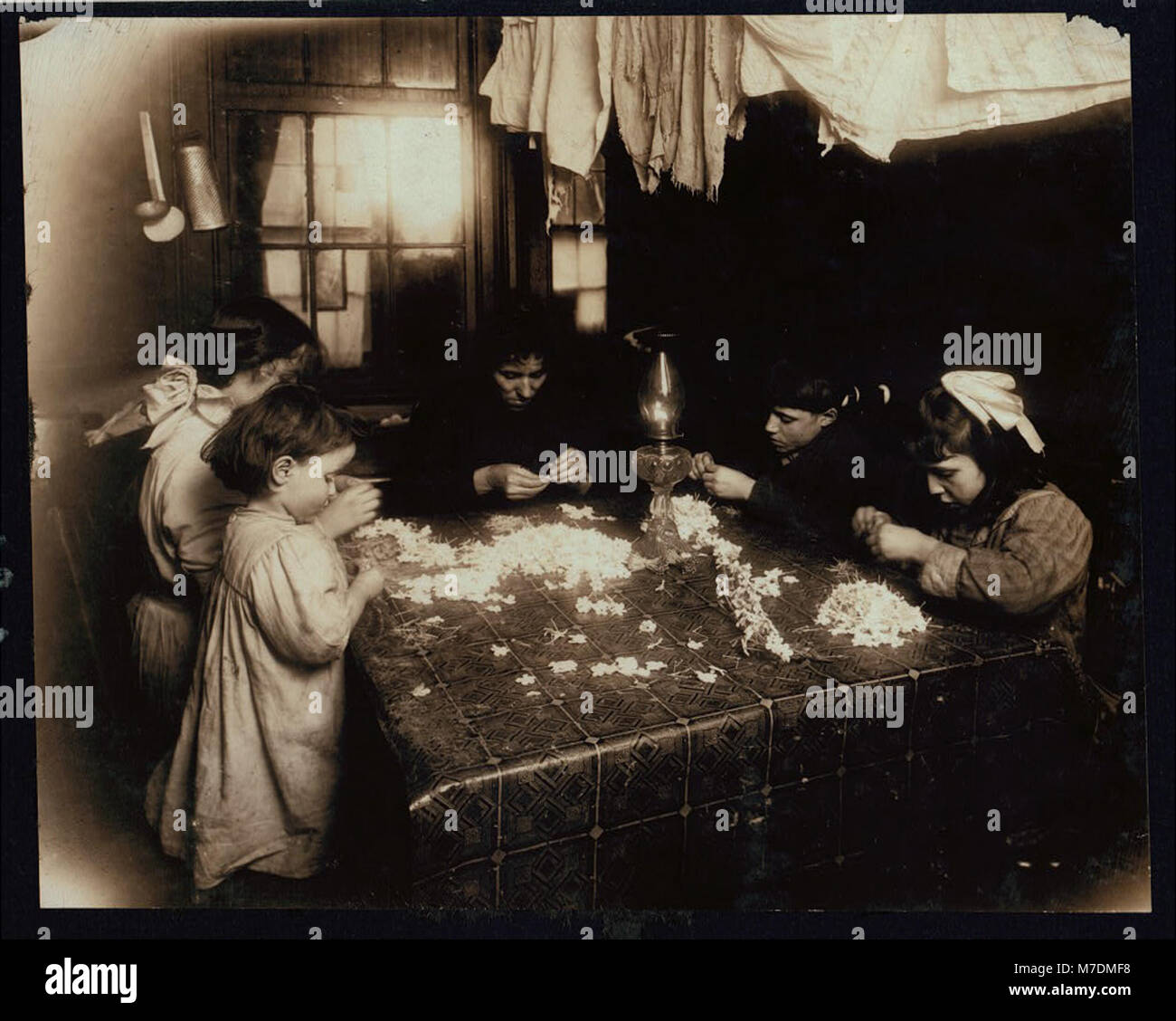 This photograph shows the Mortaria family at 8 Downing St., New York ...