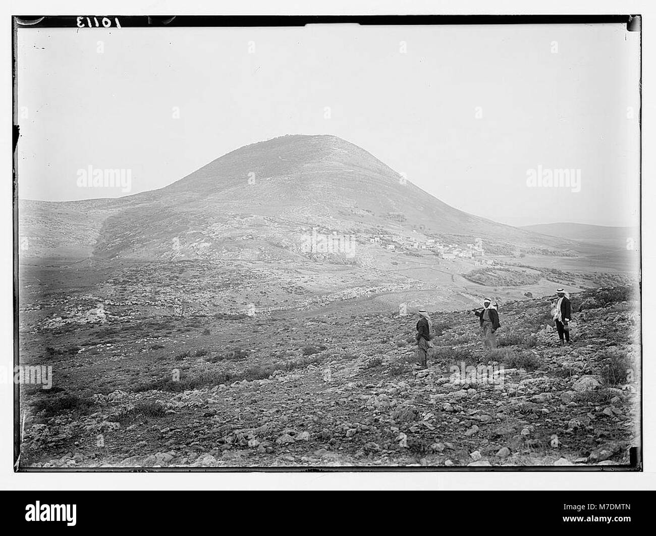 The image depicts a distant view of Mount Tabor, showcasing the ...