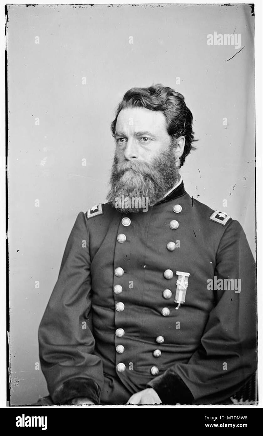 A historical photograph showing a mower in operation, reflecting ...