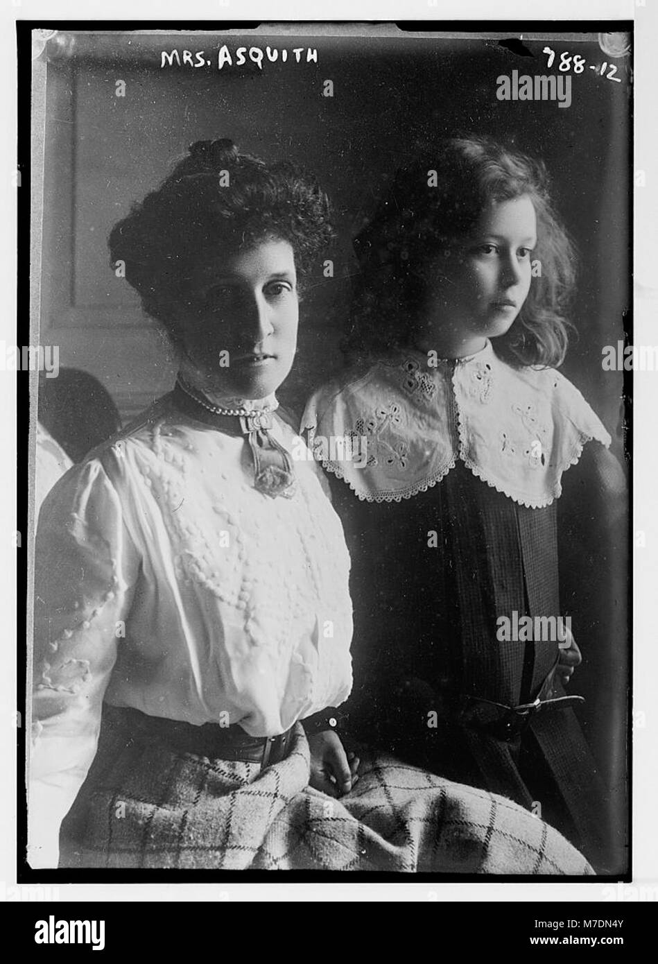 This image features Mrs. Asquith with her child, capturing a tender ...