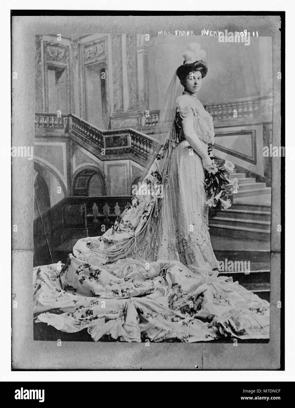 A formal portrait of Mrs. Frank Avery, captured in a classic early 20th ...