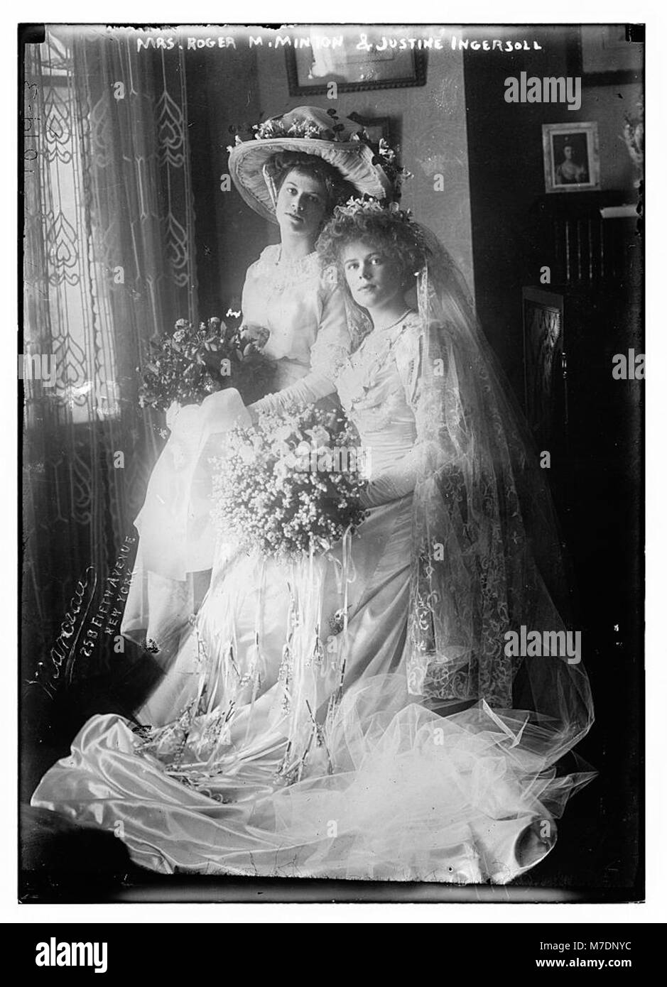 Mrs. Roger M. Minton and Justine Ingersoll seated holding bouquets ...