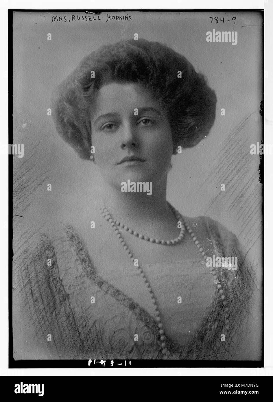 A portrait of Mrs. Russell Hopkins, an individual captured in a formal ...