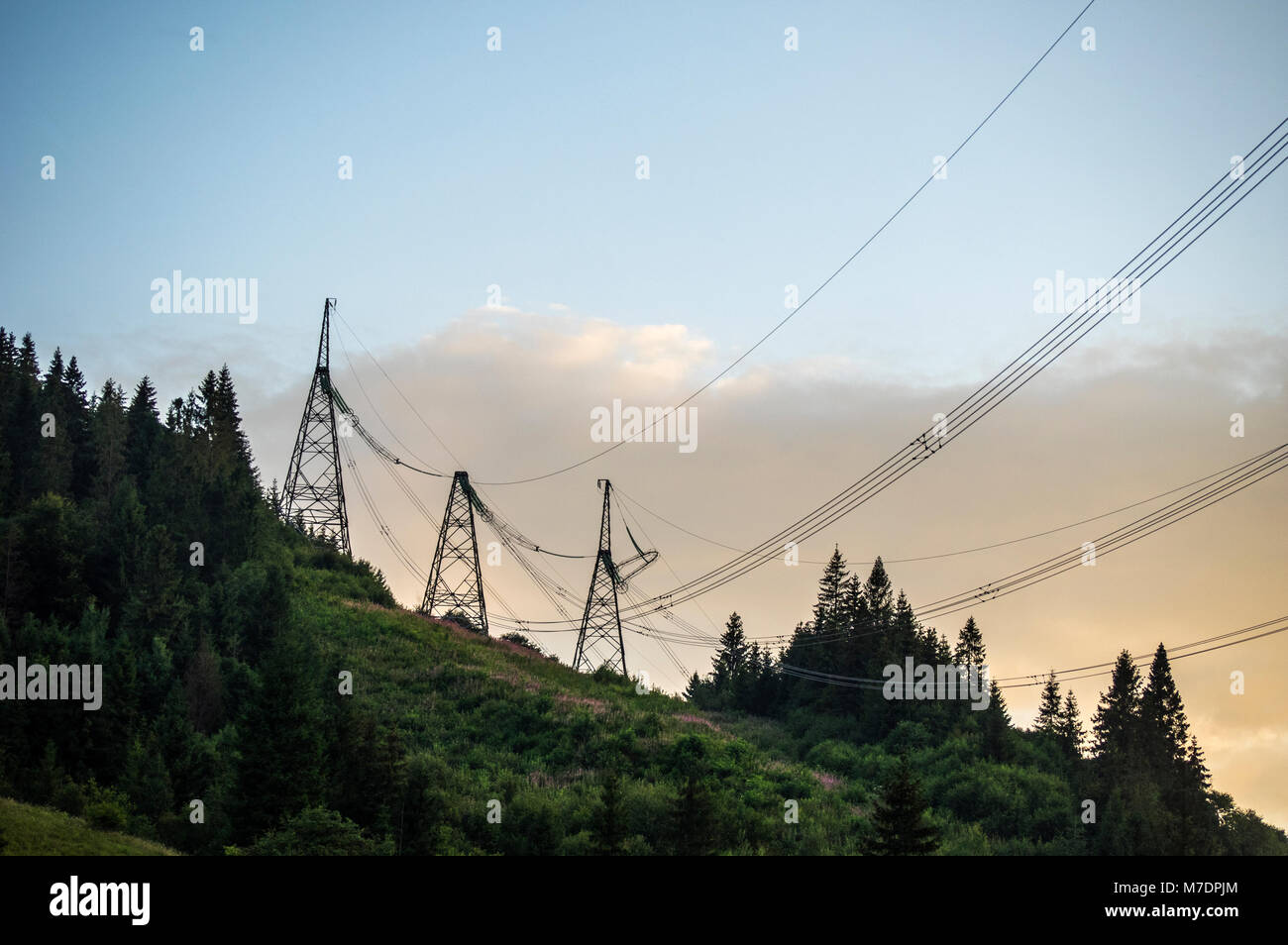 Supports of power lines in the mountains Stock Photo - Alamy