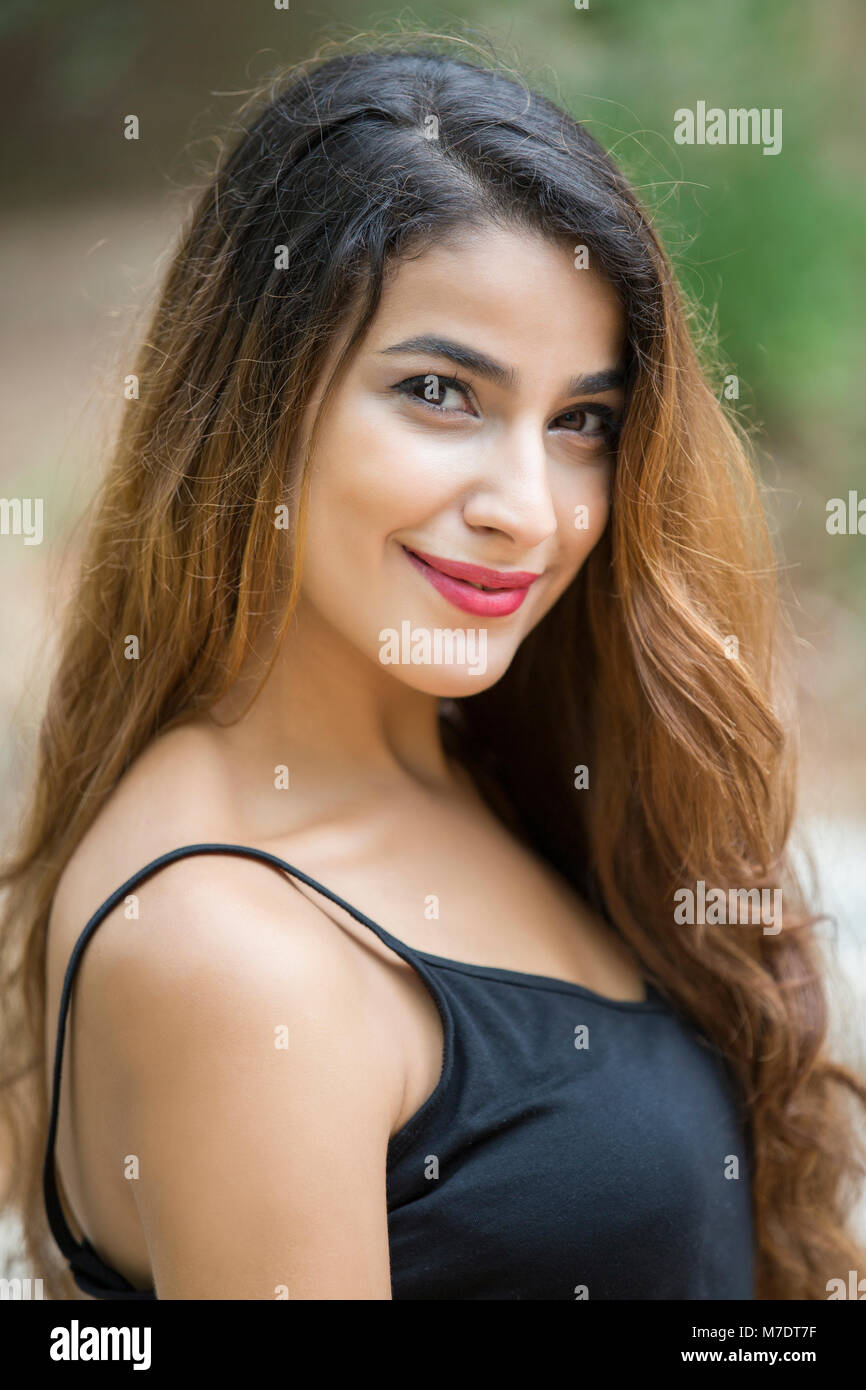Beautiful young Lebanese woman smiling outdoors Stock Photo - Alamy