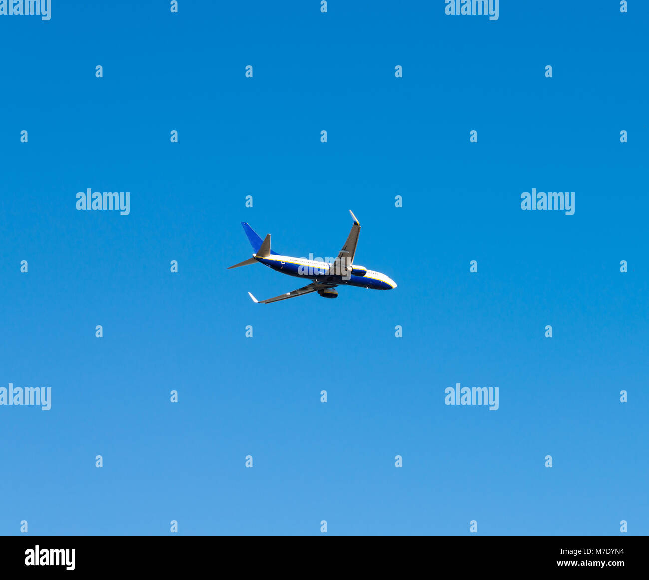 Passenger plane flying in the blue sky, cruise aircraft, transport ...
