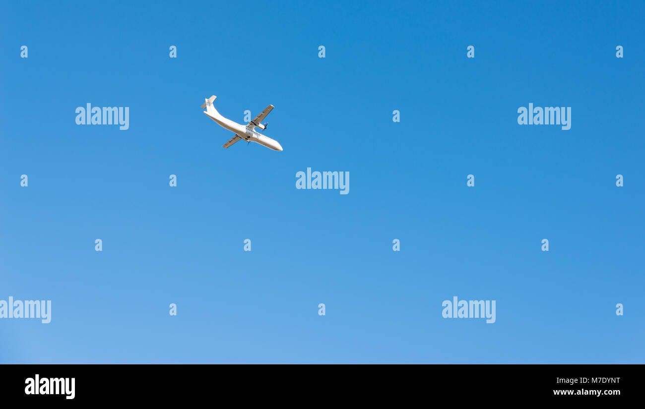 Passenger plane flying in the blue sky, cruise aircraft, transport ...