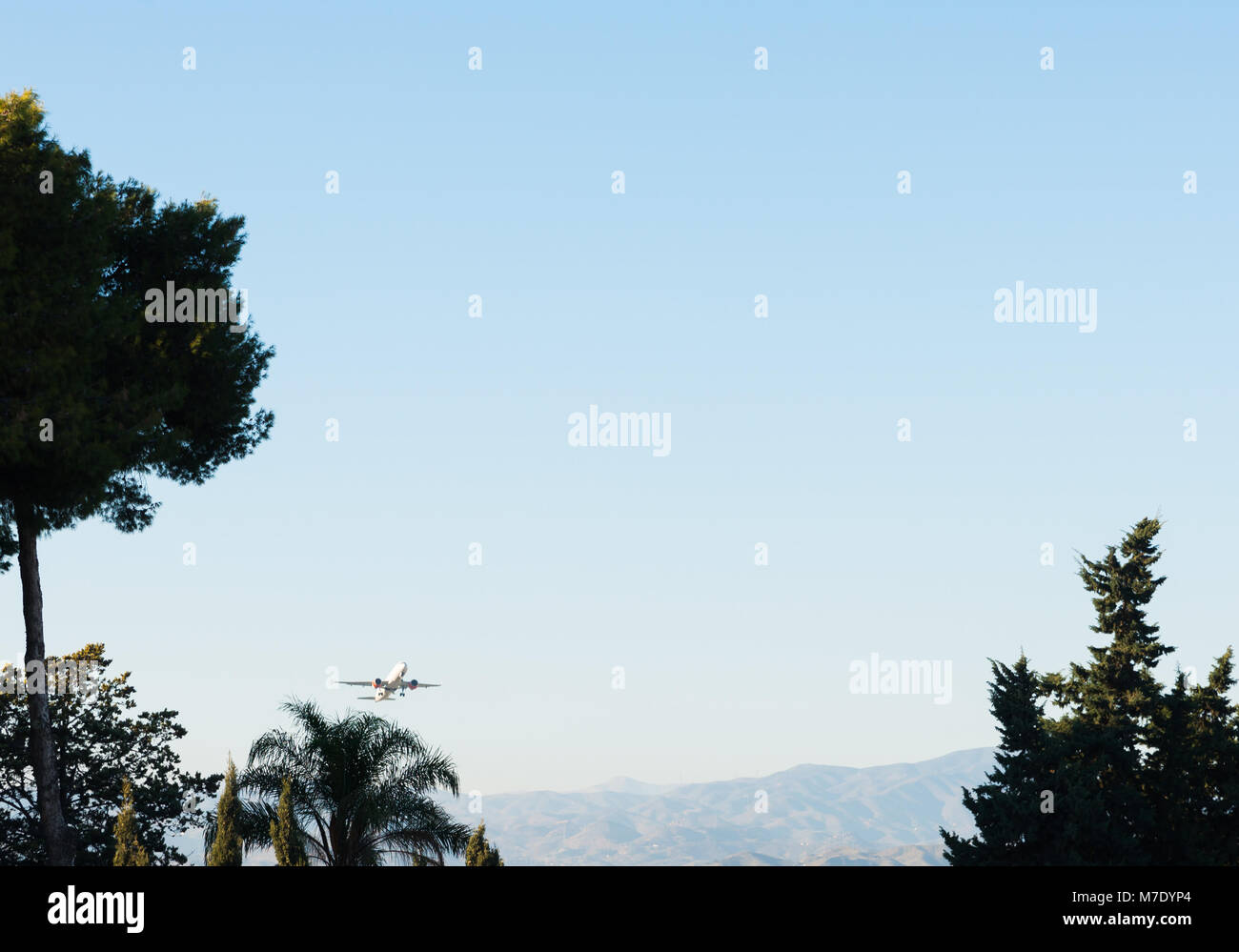 Passenger plane flying in the blue sky, cruise aircraft, transport ...