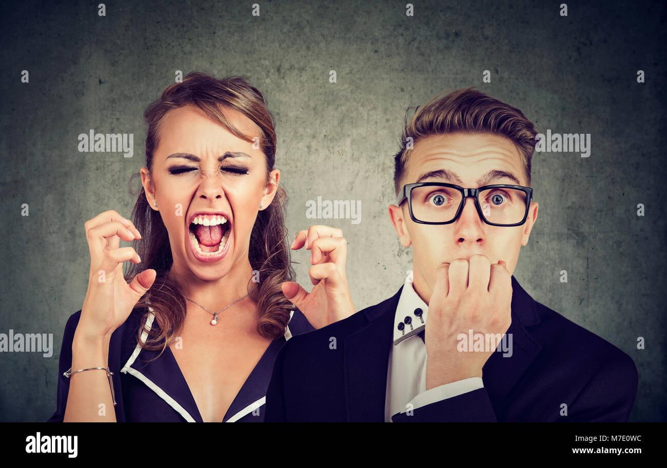 Angry mad woman screaming and fearful stressed man Stock Photo - Alamy