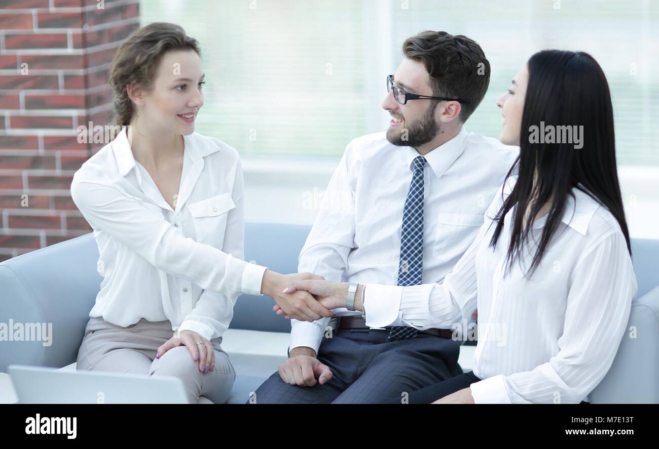 handshake of manager and client in the office lobby Stock Photo - Alamy