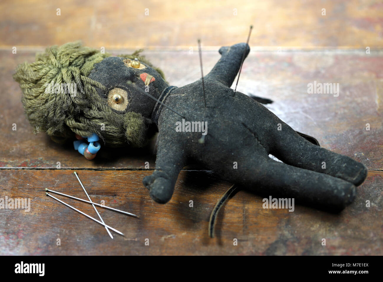 vintage voodoo doll on wooden background Stock Photo - Alamy
