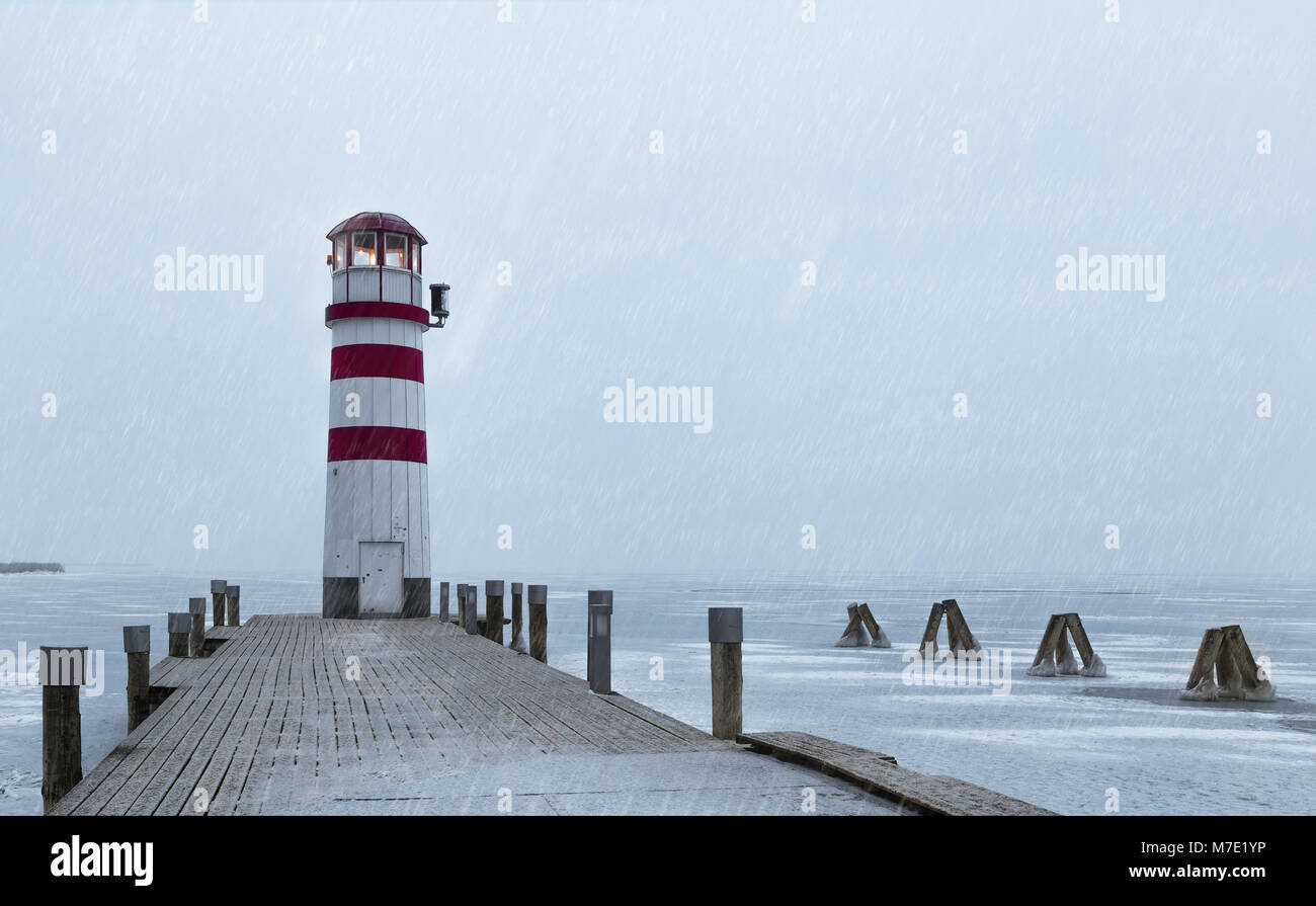 Morning with rain and fog, lighthouse at winter Stock Photo - Alamy