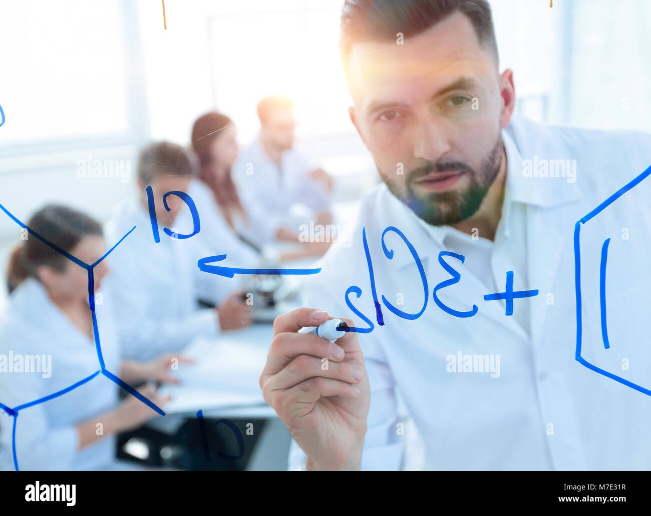 closeup of a serious scientist working with formulas Stock Photo - Alamy