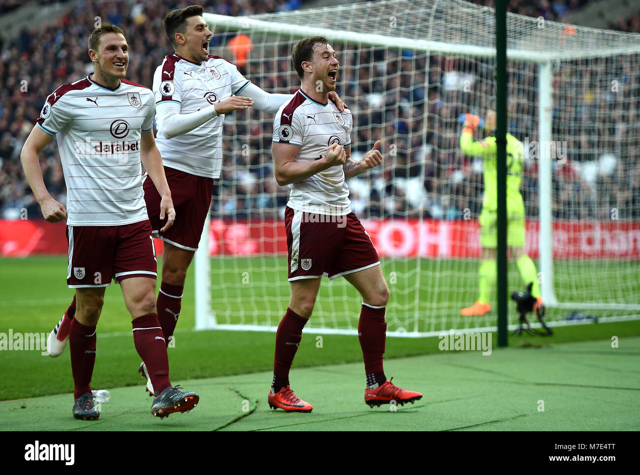 Burnley's Ashley Barnes (centre) celebrates scoring his side's first ...