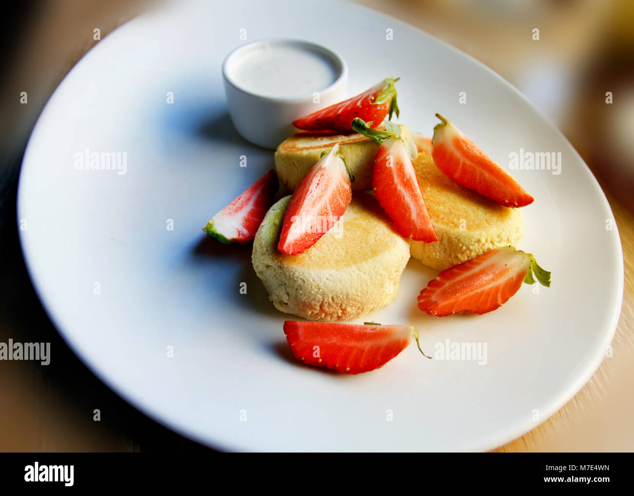Photo of a macro of delicious cheese cakes with strawberries on a sunny ...