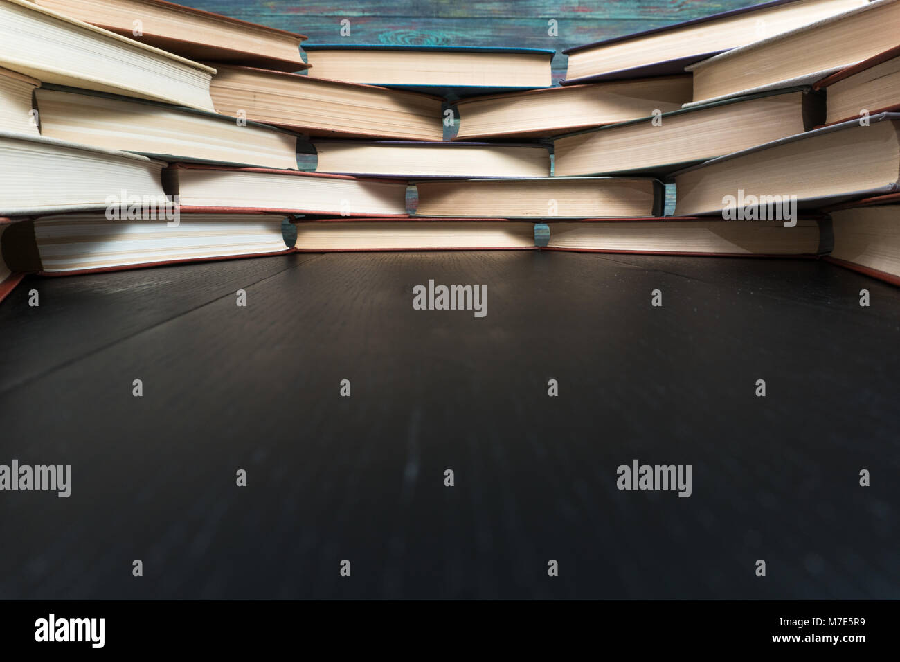 Book hardback on wooden table Stock Photo - Alamy