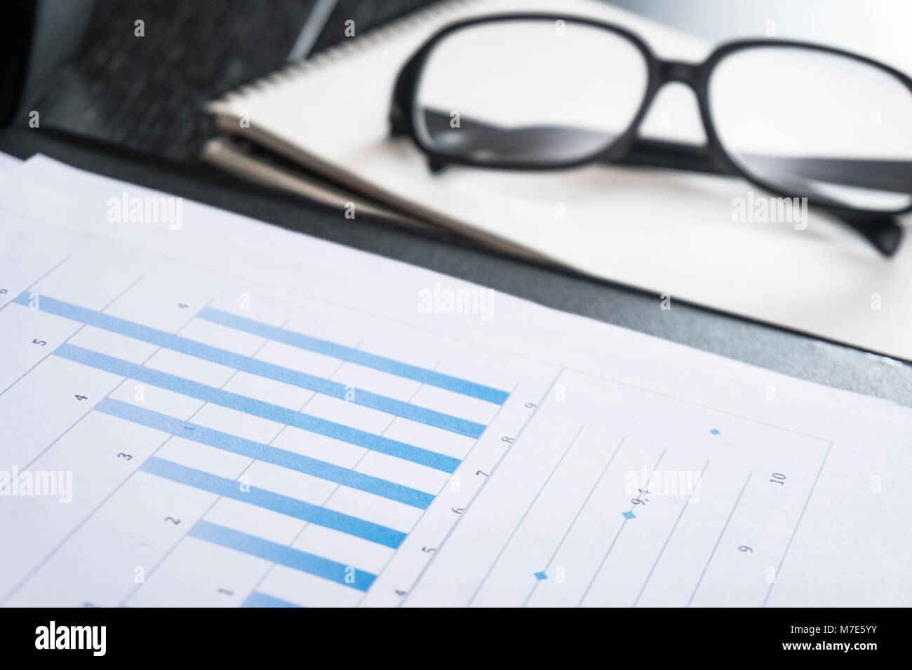 Business accessories on a background of diagrams. Copy space for text ...