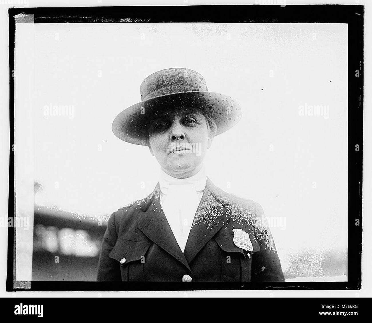 A portrait of Mrs. Van Winkle, capturing her in a formal setting. The ...