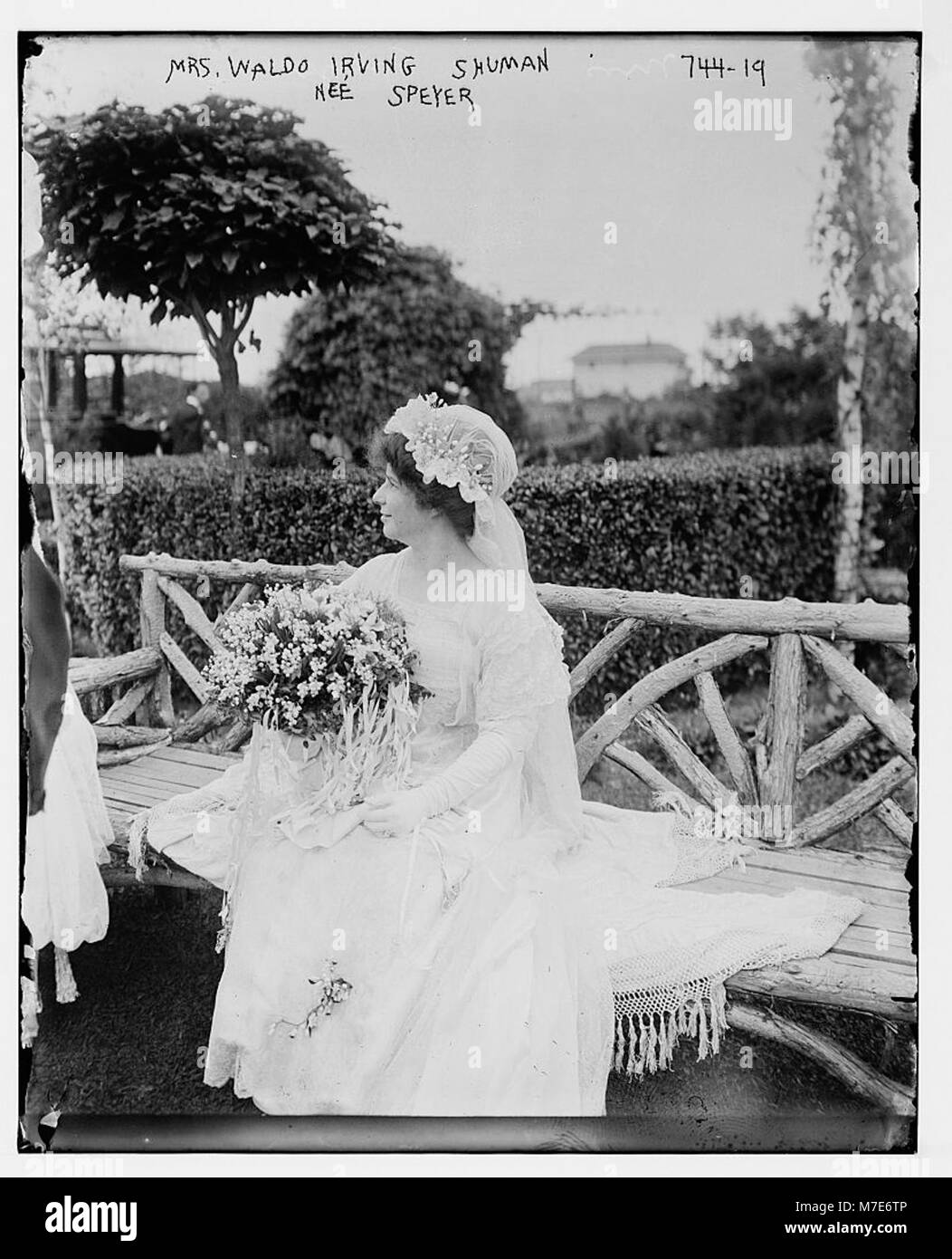 Mrs. Waldo Irving Shuman, nee Speyer, seated on bench, holding bouquet ...