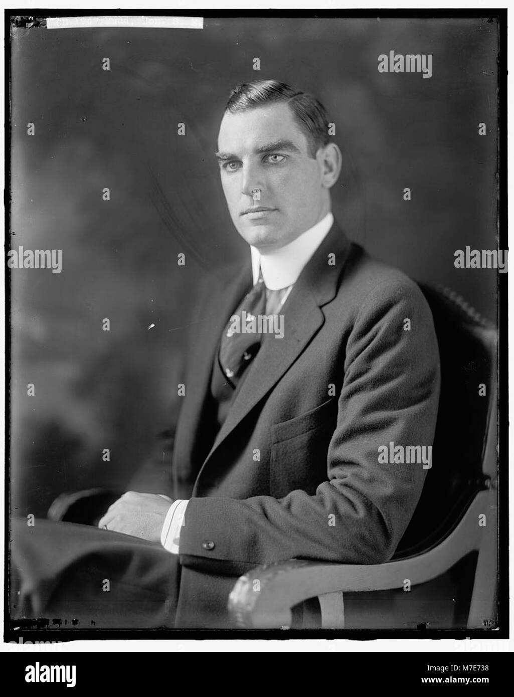 This portrait honors S.E. Mudd, depicted in a formal pose. Cataloged ...