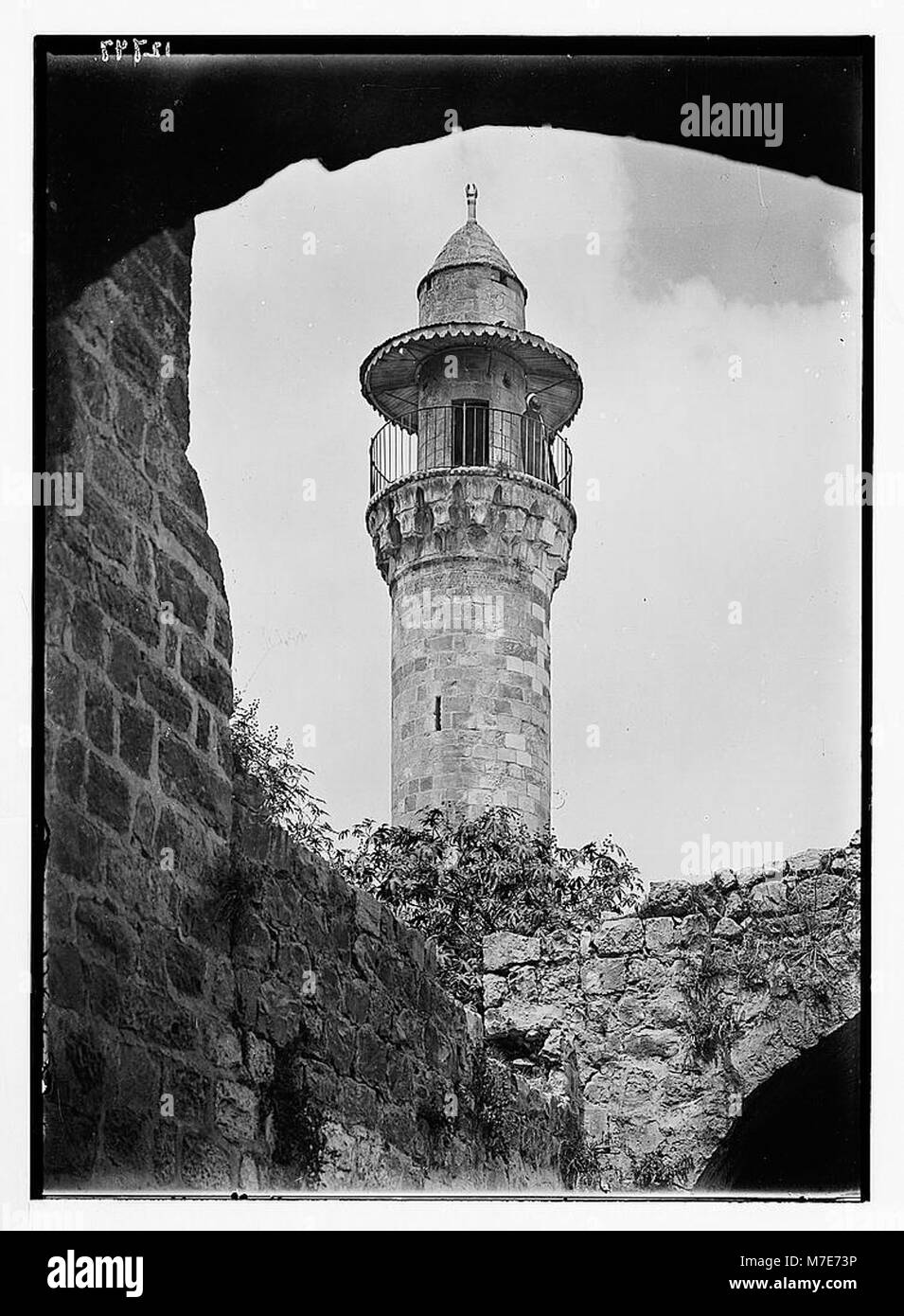 A muezzin calls out the hour of prayer from a minaret in this image, a ...