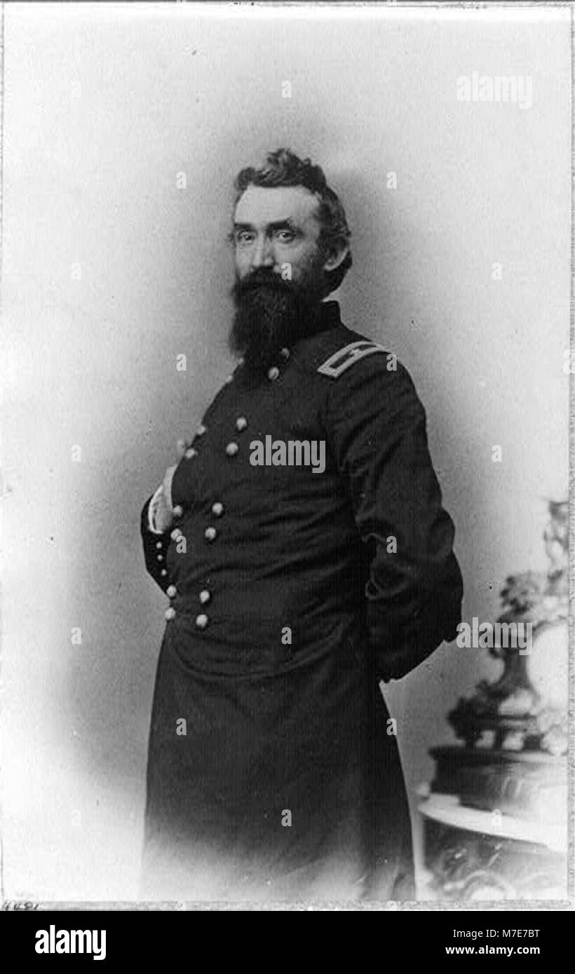 This formal portrait shows N. Kimball, standing and facing left with a ...