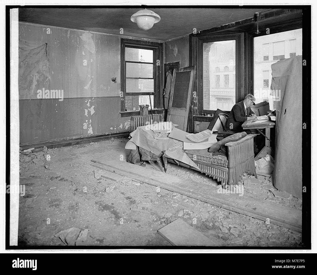 A photograph showing the front room of National Photo Co. after a fire ...