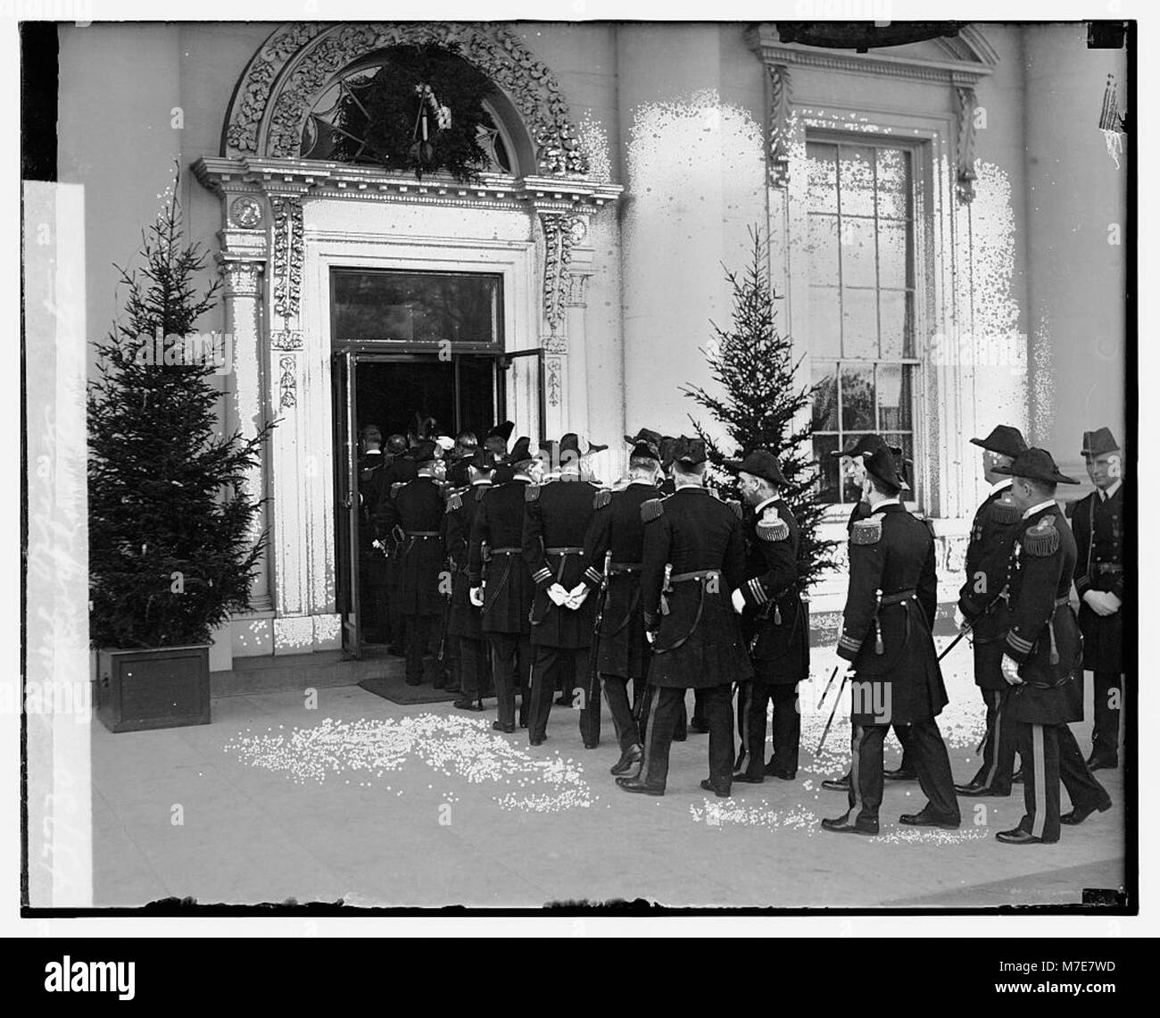 A photograph of naval officers attending a New Year reception. The ...