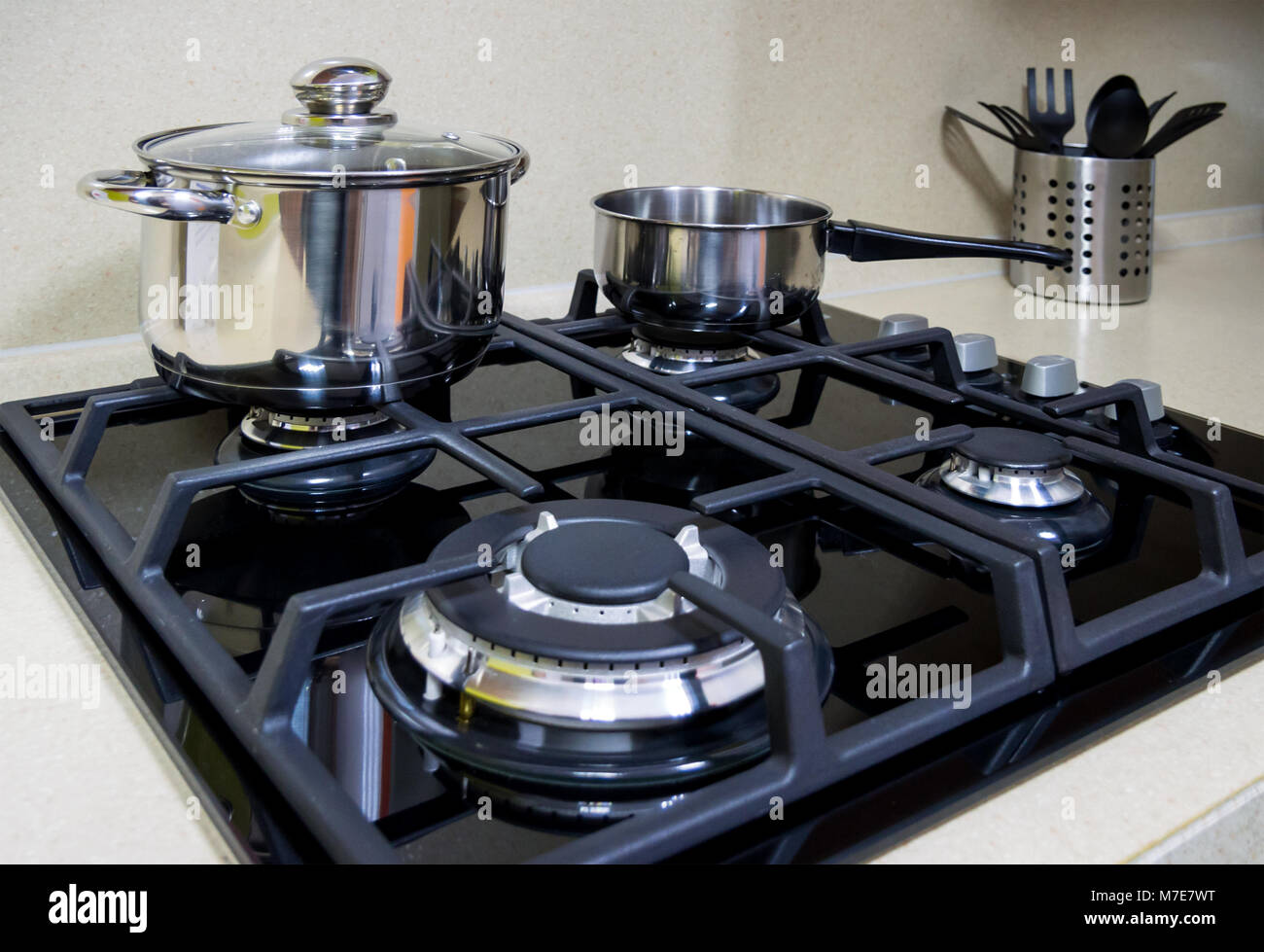 The surface of the gas cooker and the dishes standing on it Stock Photo ...