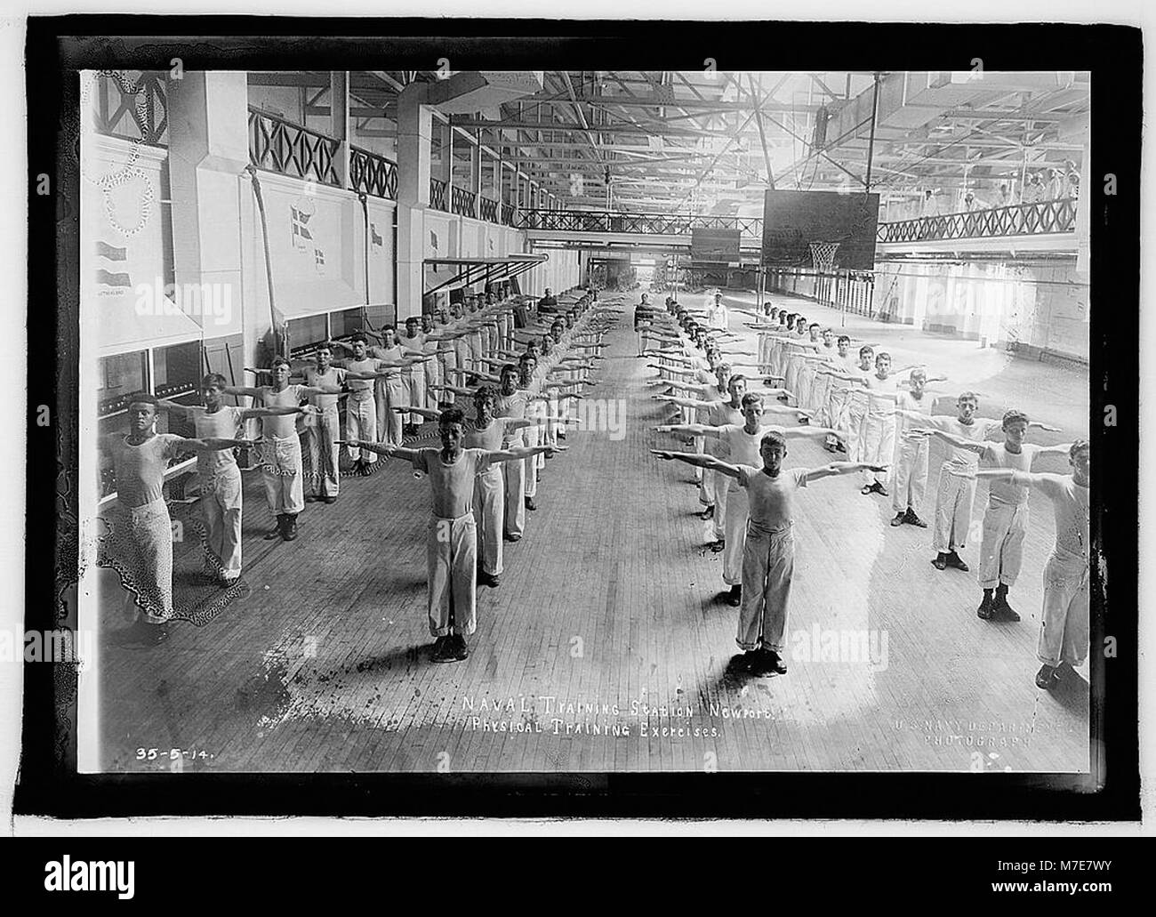 This photograph shows physical training exercises at the Naval training ...