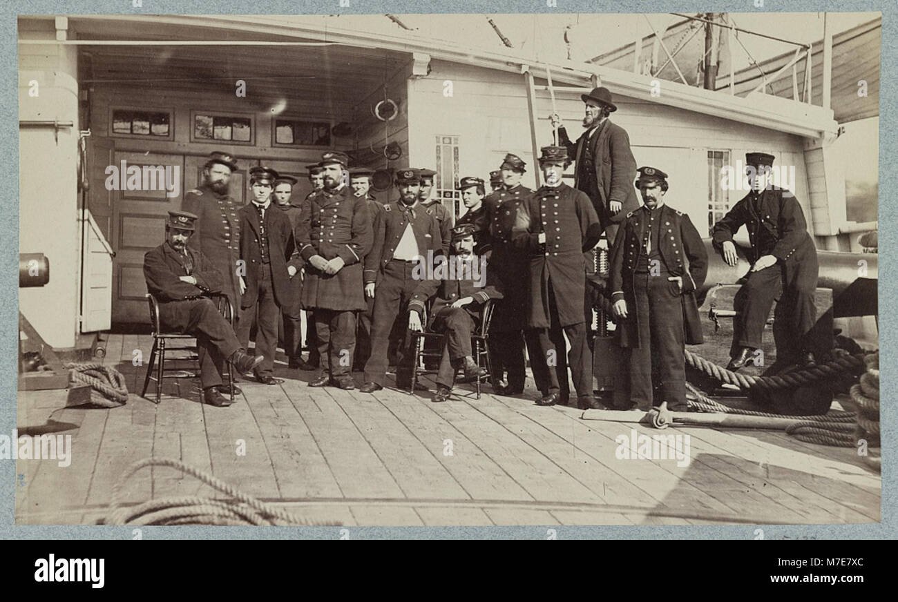 Navy crewmen are pictured on the deck of a ship, demonstrating the ...