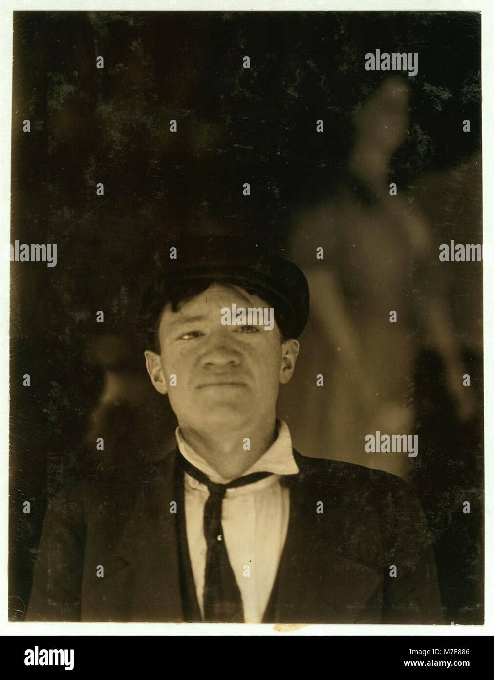 This photograph features a group of newsboys, with one man known as ...