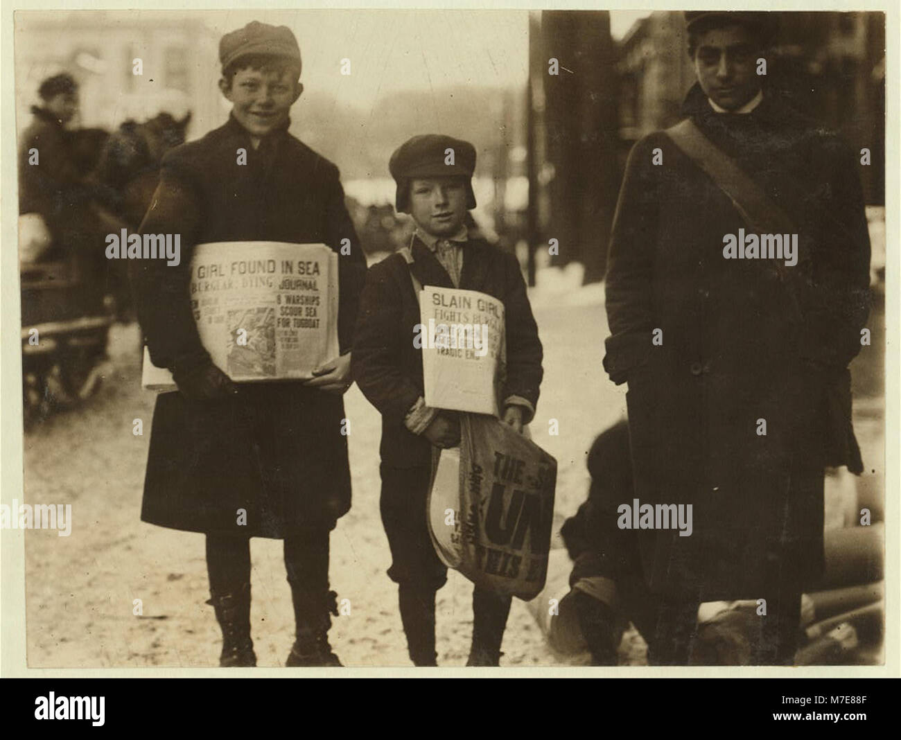 Newsboys selling papers on the streets, illustrating the role of young ...