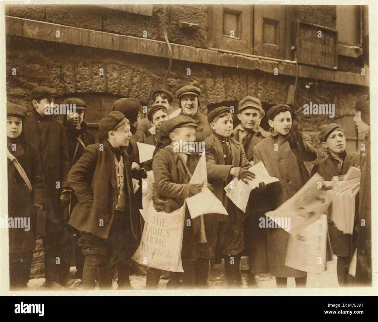 A photograph of newsboys, or 'newsies,' gathering their afternoon ...