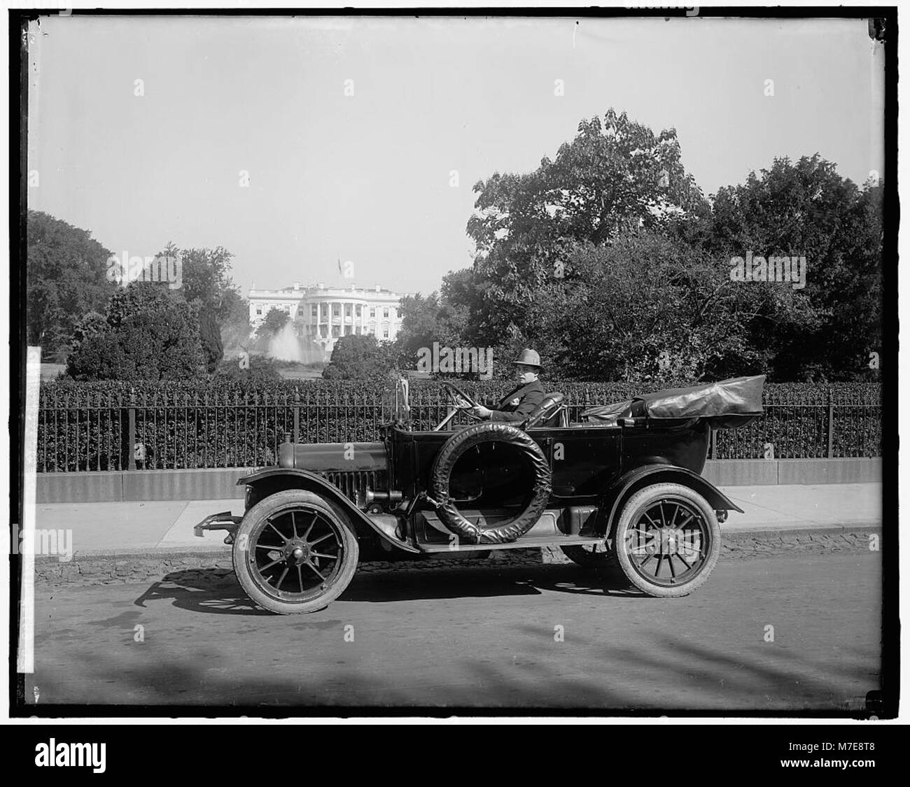A photograph of Soterios Nicholson in an automobile with the White ...