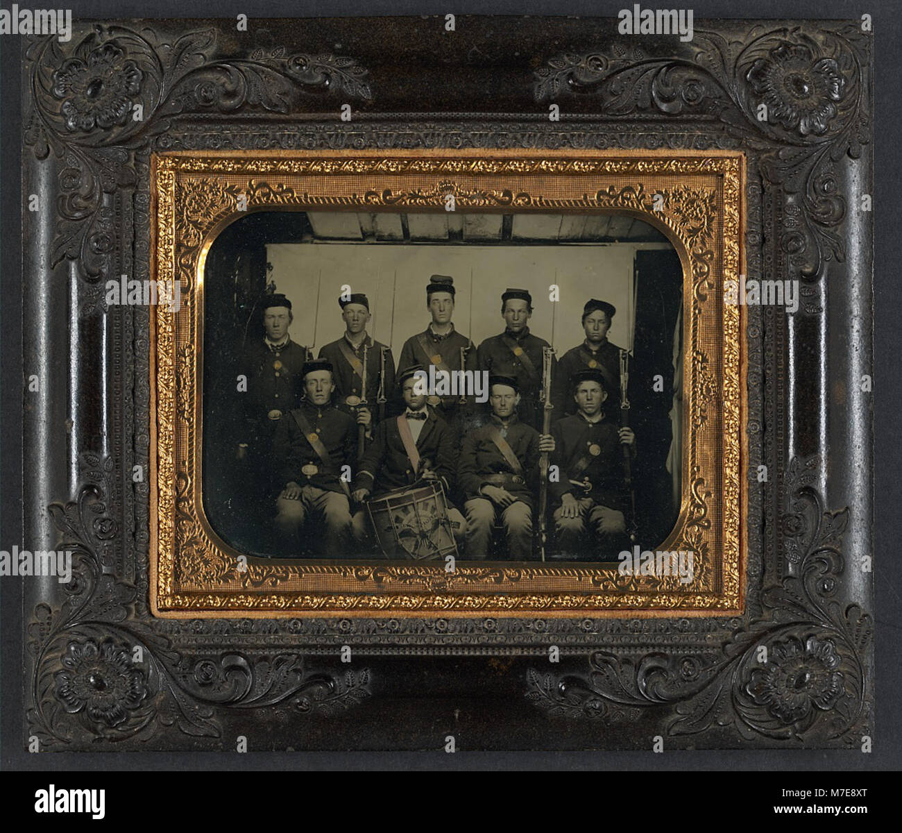 A photograph featuring nine soldiers dressed in Union uniforms from the ...